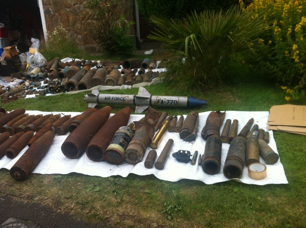 Giant MISSILE found with World War weapons stash at house in Dukinfield ...