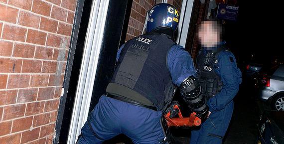 Hundreds of police swoop on north Manchester homes in dawn drugs raids ...